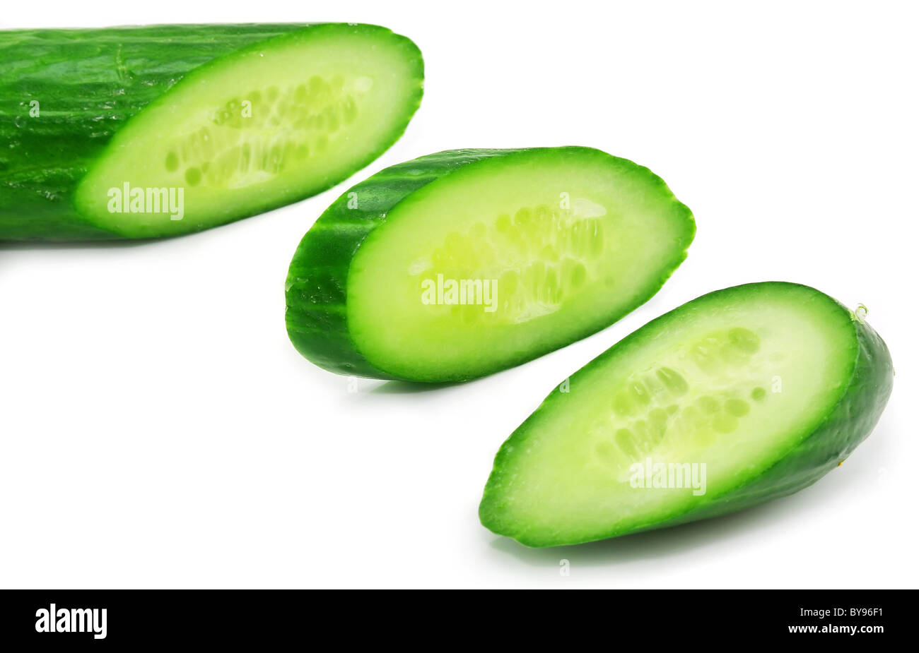Slices of fresh green cucumber isolated Stock Photo - Alamy