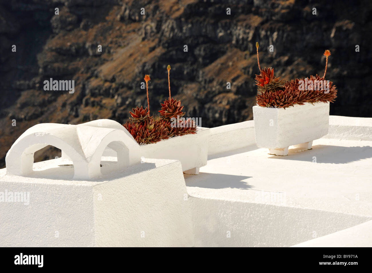 Unusual chimney pots and rooftops on the Greek island of Santorini in ...