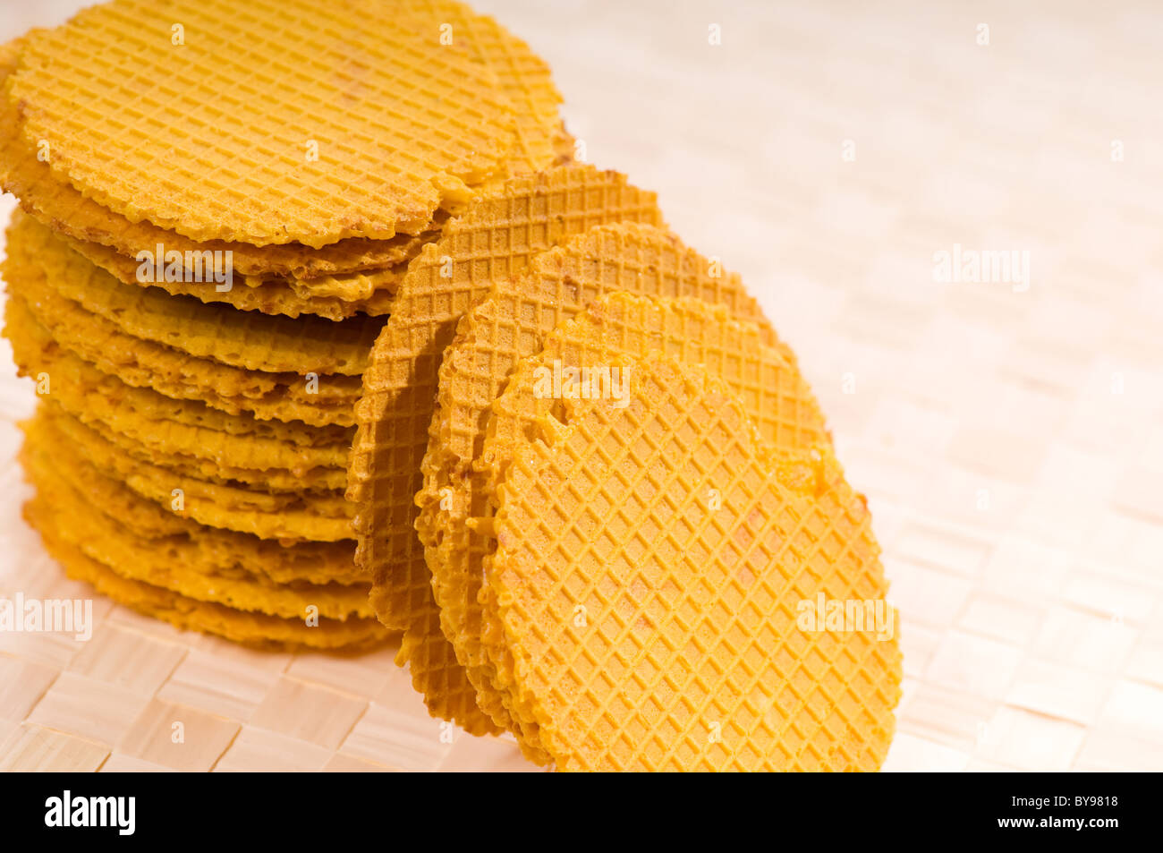 orange colour wafers stack lying on beige mat Stock Photo - Alamy