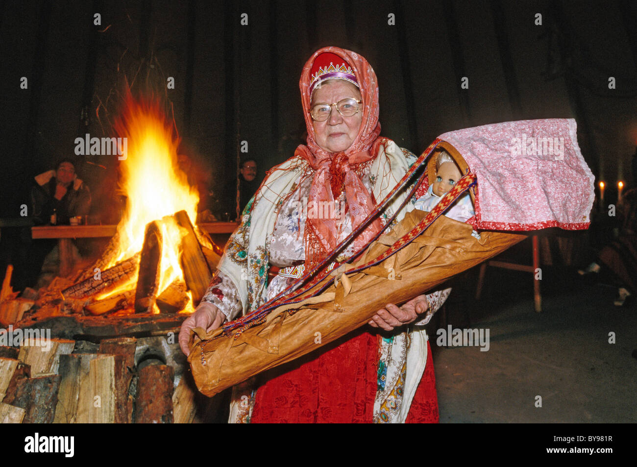 Kirkenes, North Norway, traditional dressed Sami woman in a tent with ...