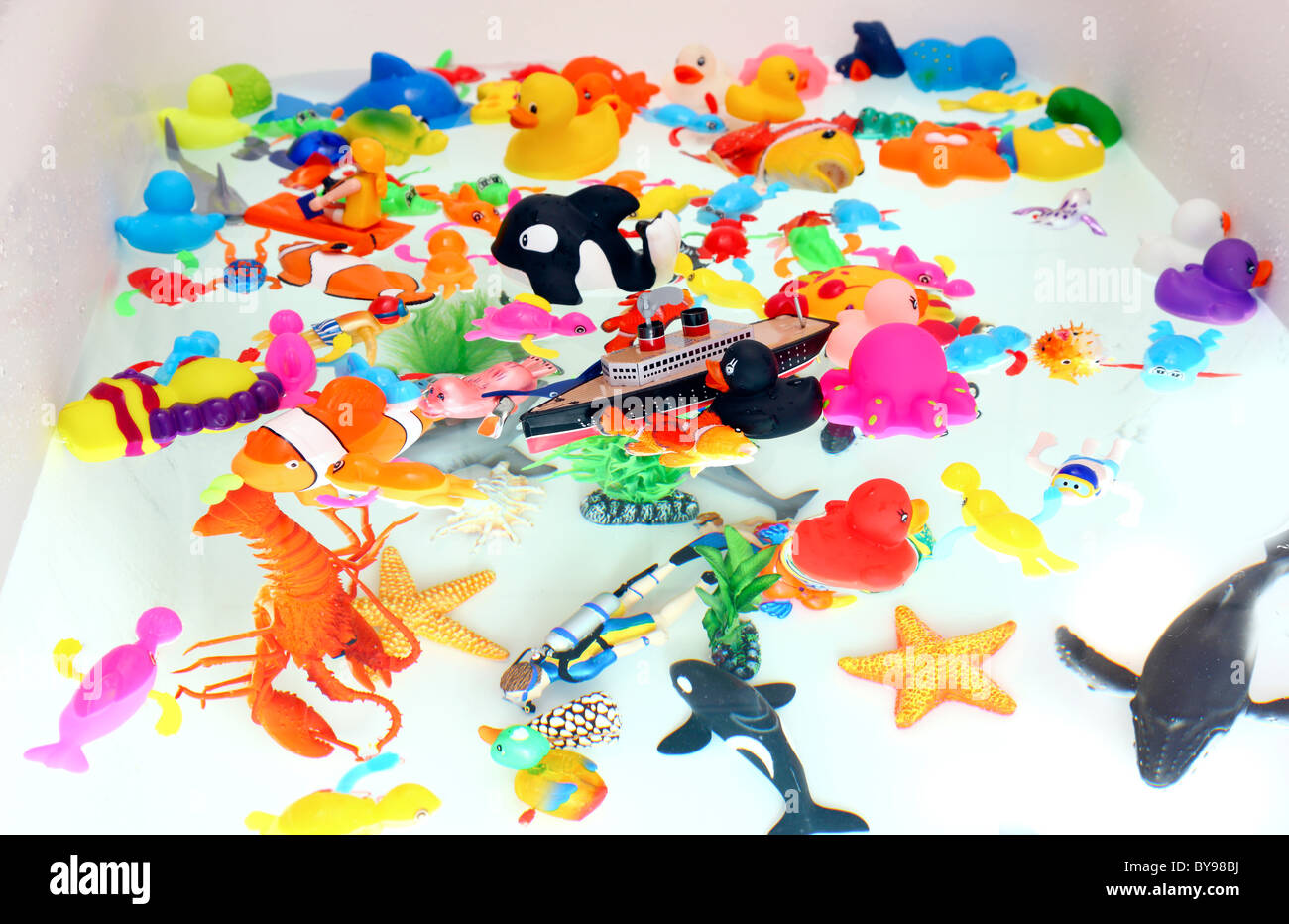 Bath toys, different colorful figures for kids to play with in a pool ...