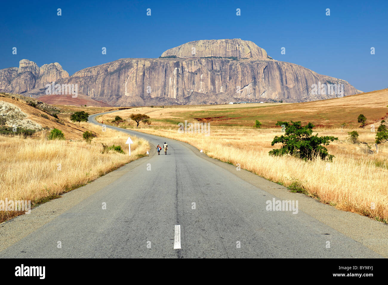 Malagasy couple walking on the road leading to Fandana (the gateway to ...