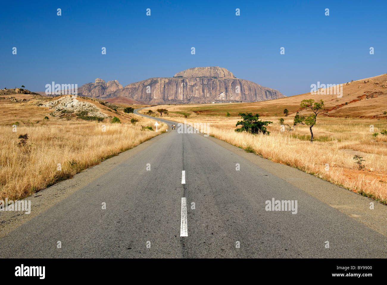 Malagasy couple walking on the road leading to Fandana (the gateway to ...