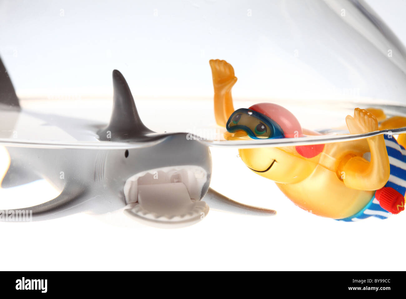 Swimmer and a shark in a fish bowl. Wind up toys Stock Photo - Alamy