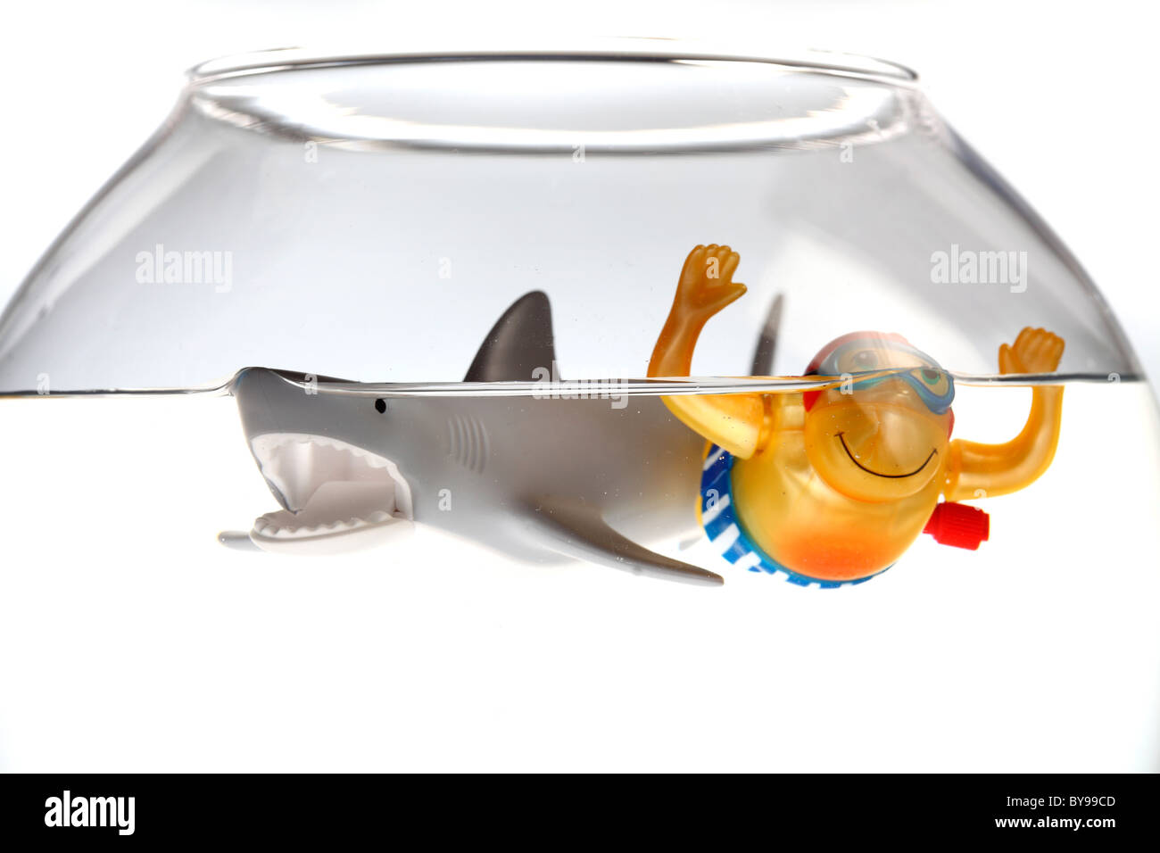 Swimmer and a shark in a fish bowl. Wind up toys Stock Photo - Alamy