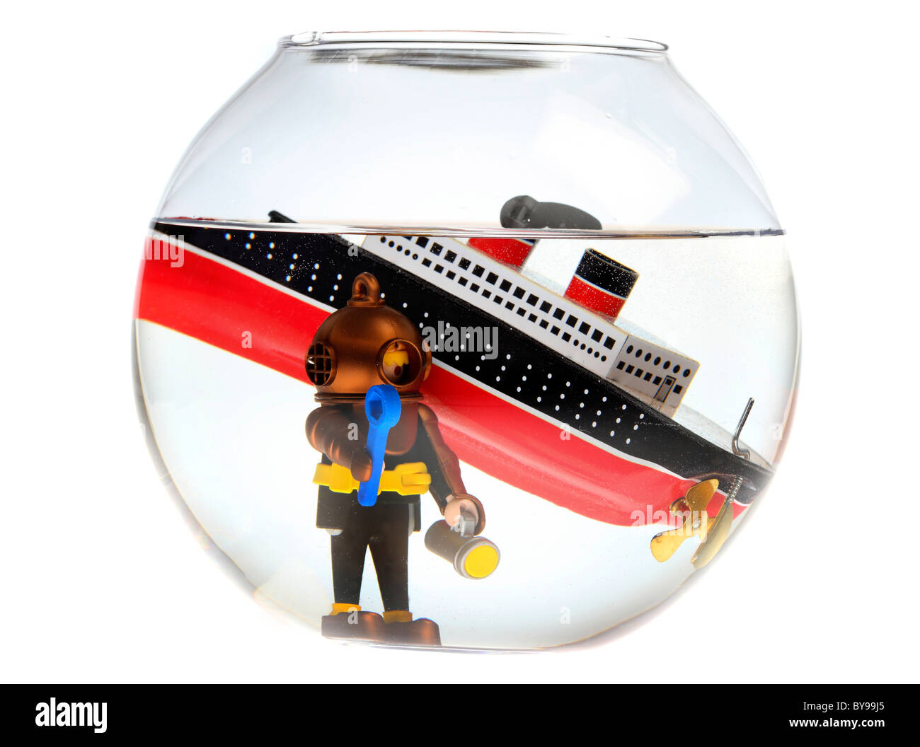 Sunken cruise ship in a fish bowl. Diver with tools. Mechanic tin toy ...
