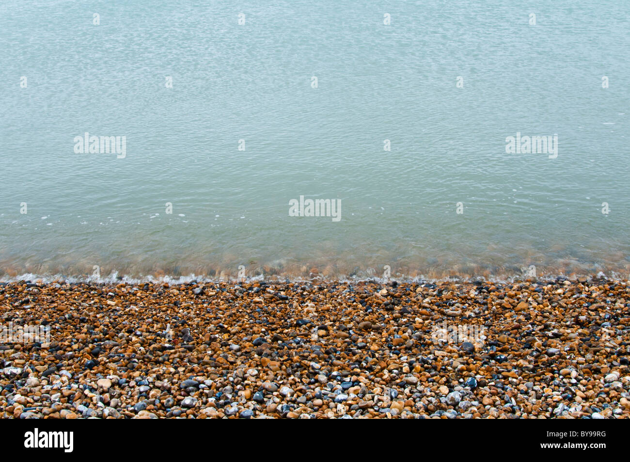 Seashore with pebbles Stock Photo - Alamy