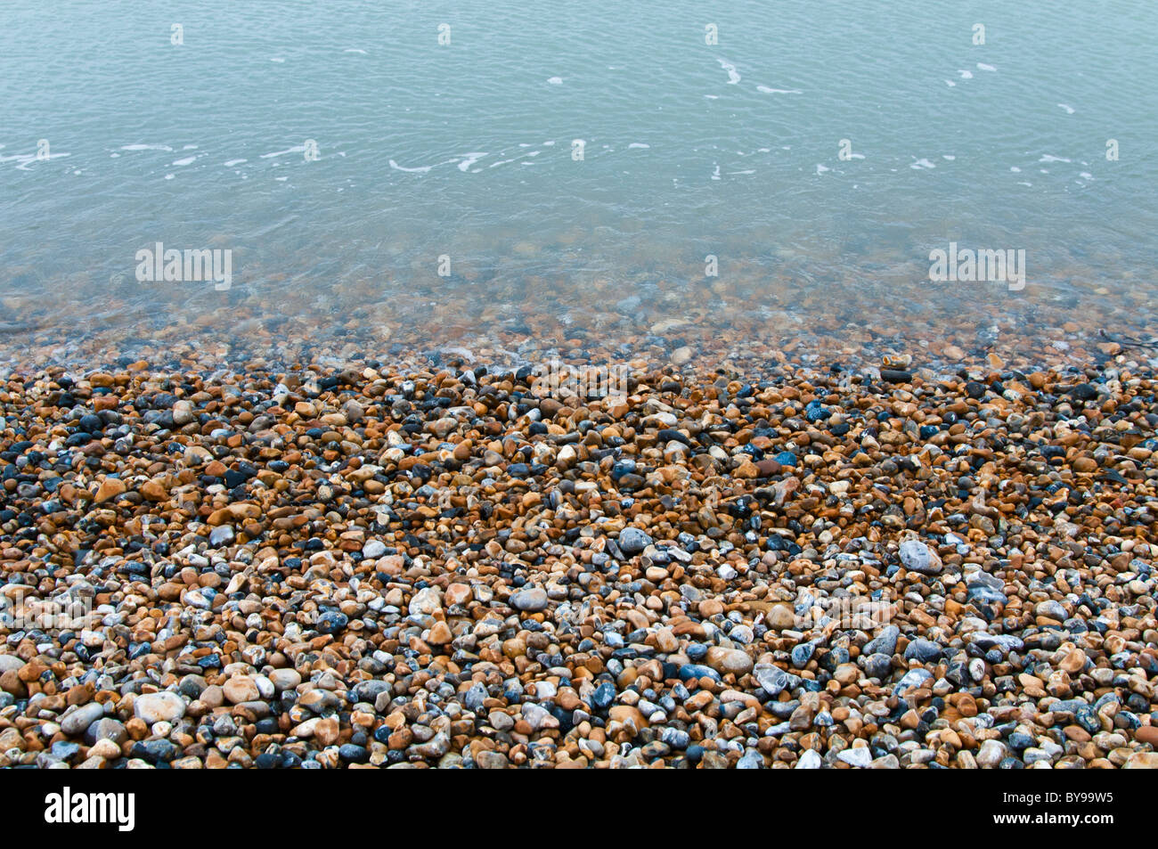 Seashore with pebbles Stock Photo - Alamy