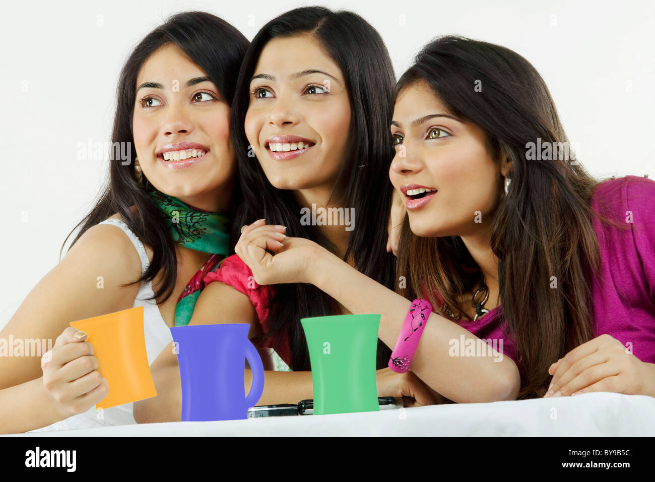 Friends looking at something Stock Photo - Alamy