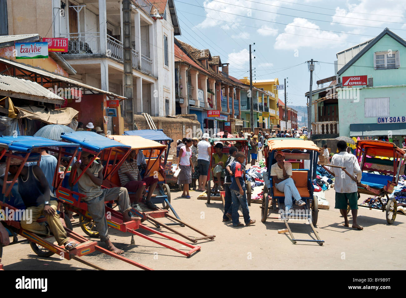 Rickshaws lined up in the town of Ambositra in south-central Madagascar ...
