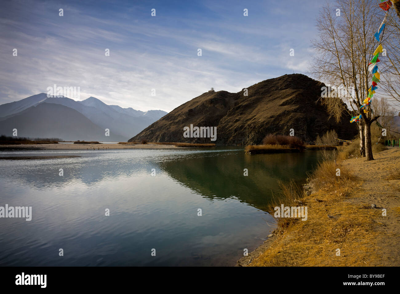 Mountains across Lhasa River near Nie Tang Buddha alongside the road ...