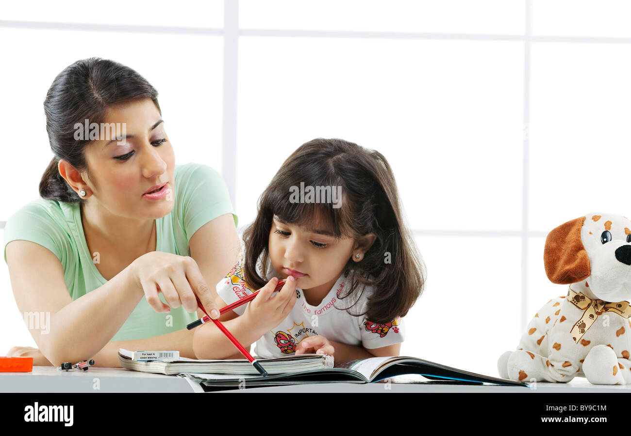 Mother teaching her daughter Stock Photo - Alamy Mother teaching her daughter Stock Photo - Alamy