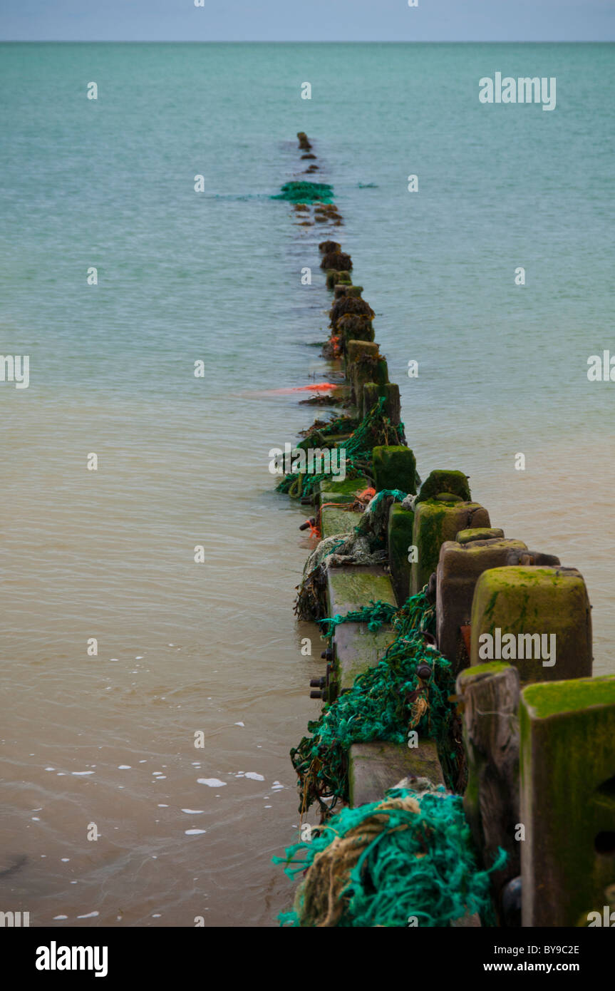 Calm sea with breakwater groin Stock Photo - Alamy