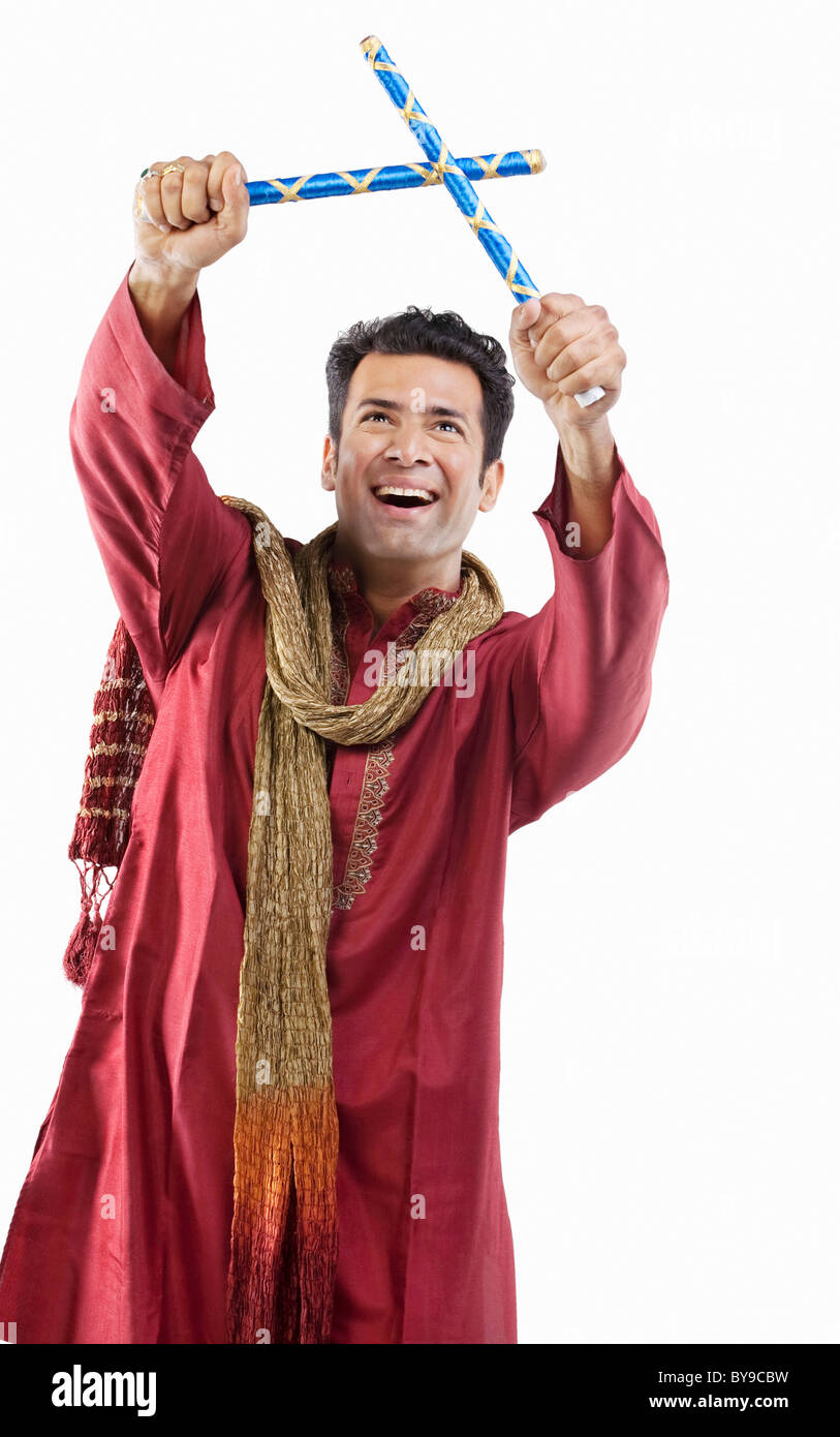 Gujarati man with dandiya sticks Stock Photo - Alamy