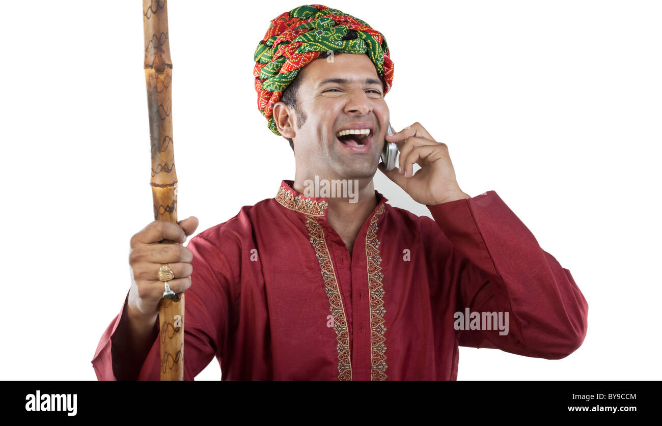 Gujarati man talking on a mobile phone Stock Photo - Alamy