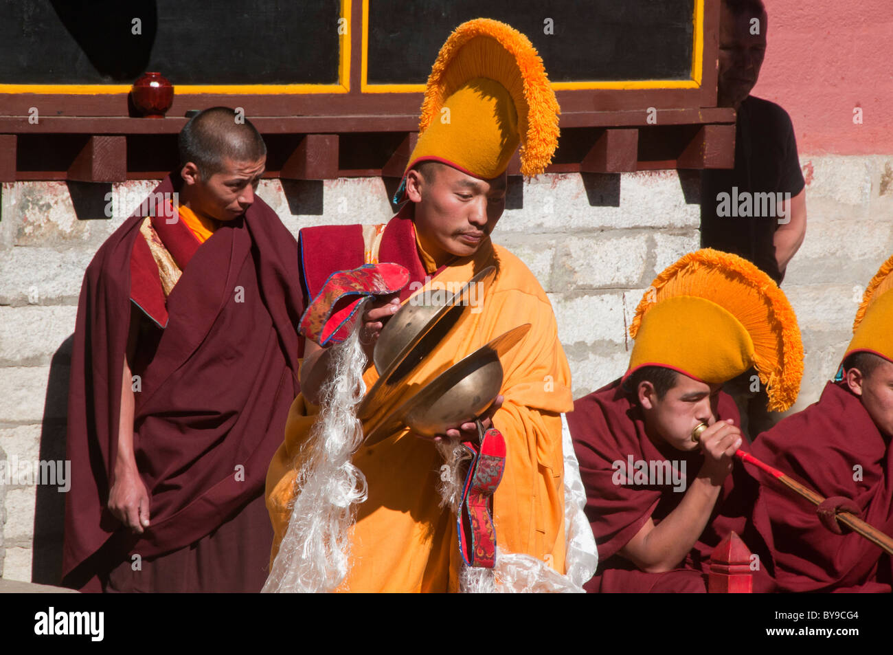 yellow hat monk plays a cymbal at the Mani Rimdu Festival at Tengboche ...