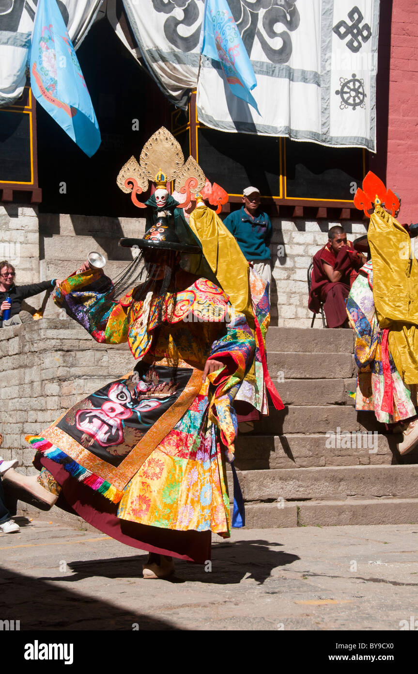 costumed monk dancing at the Mani Rimdu Festival at Tengboche Monastery ...