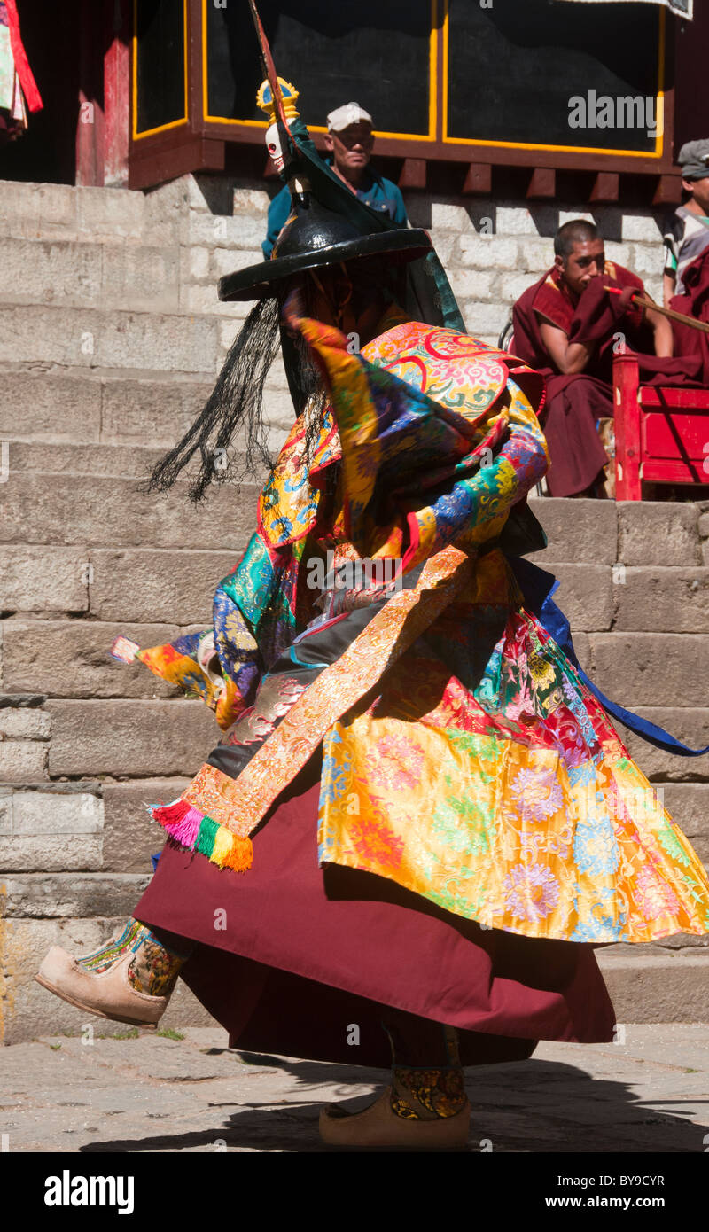 costumed monk dancing at the Mani Rimdu Festival at Tengboche Monastery ...