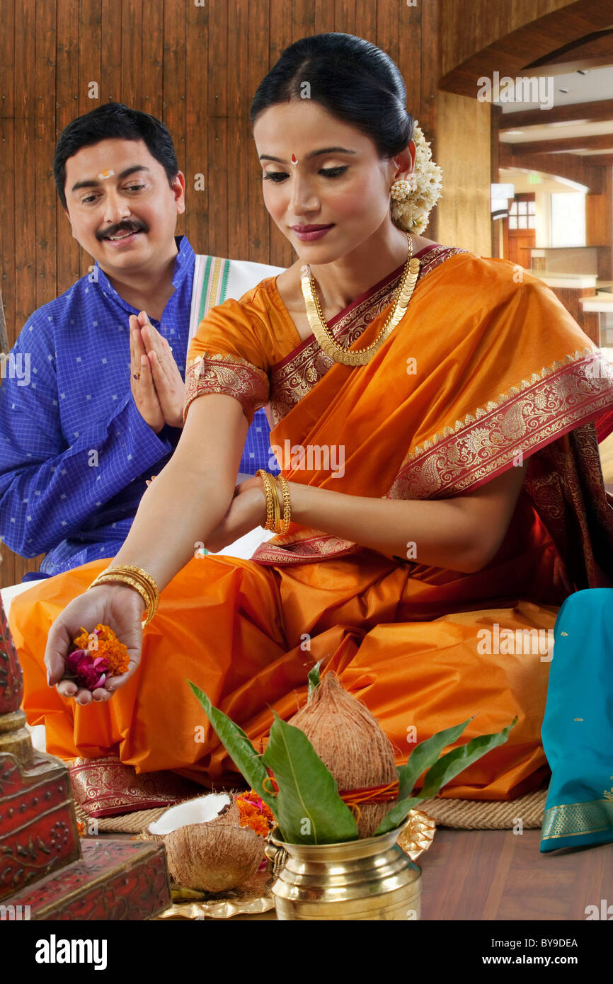 South Indian woman making an offering Stock Photo - Alamy