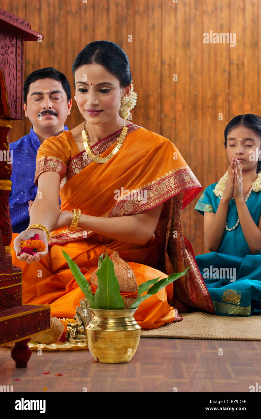 South Indian woman making an offering Stock Photo - Alamy