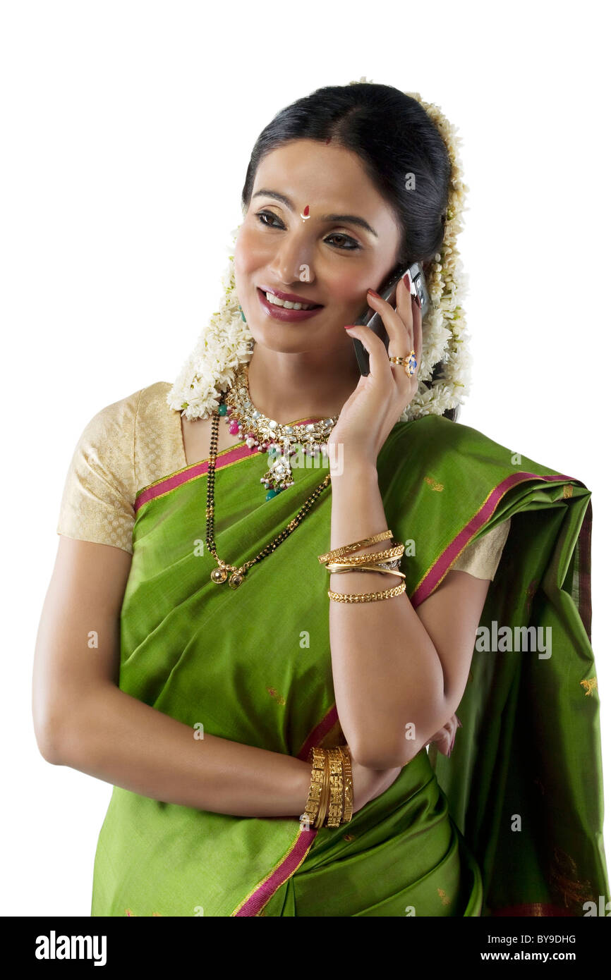 South Indian woman talking on a mobile phone Stock Photo - Alamy