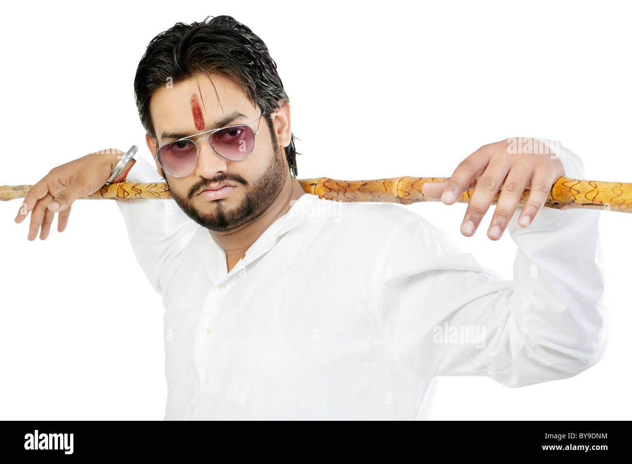 Portrait of a man with a stick Stock Photo - Alamy