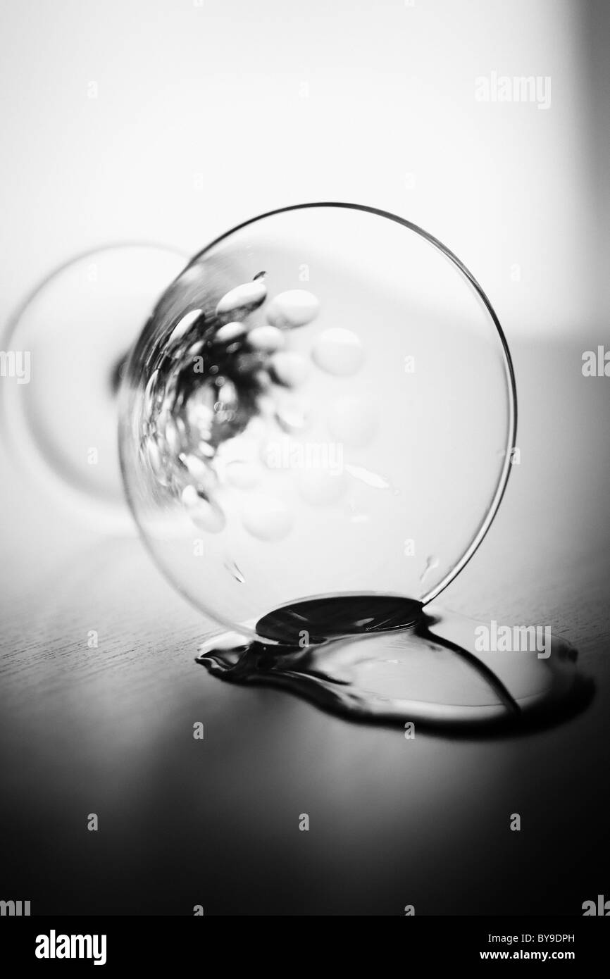 Lying cocktail glass, black and white Stock Photo - Alamy