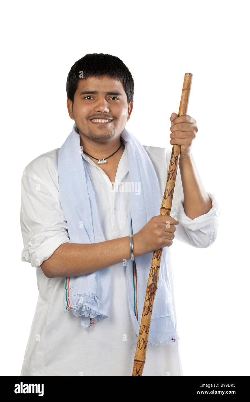 Portrait of a man with a stick Stock Photo - Alamy