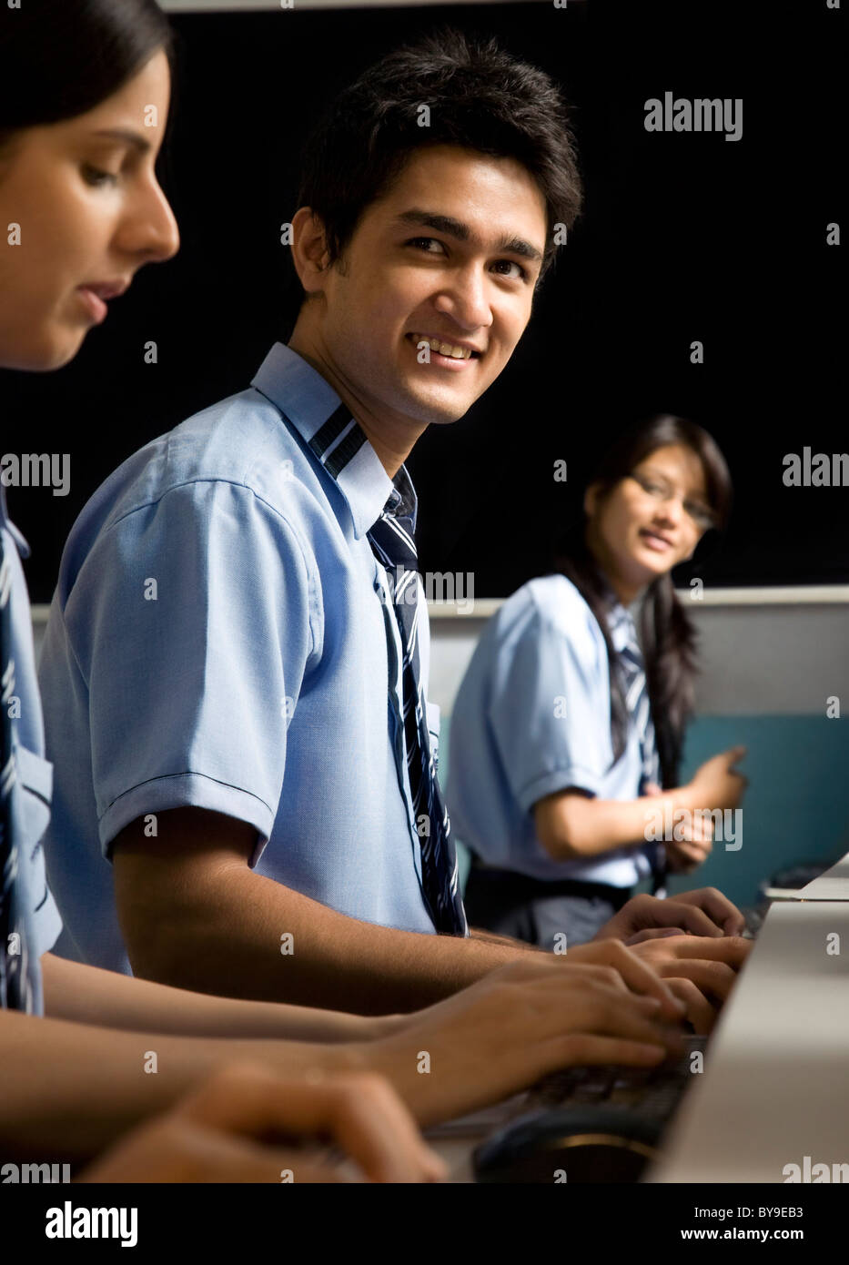 Portrait of a student in a computer lab Stock Photo - Alamy