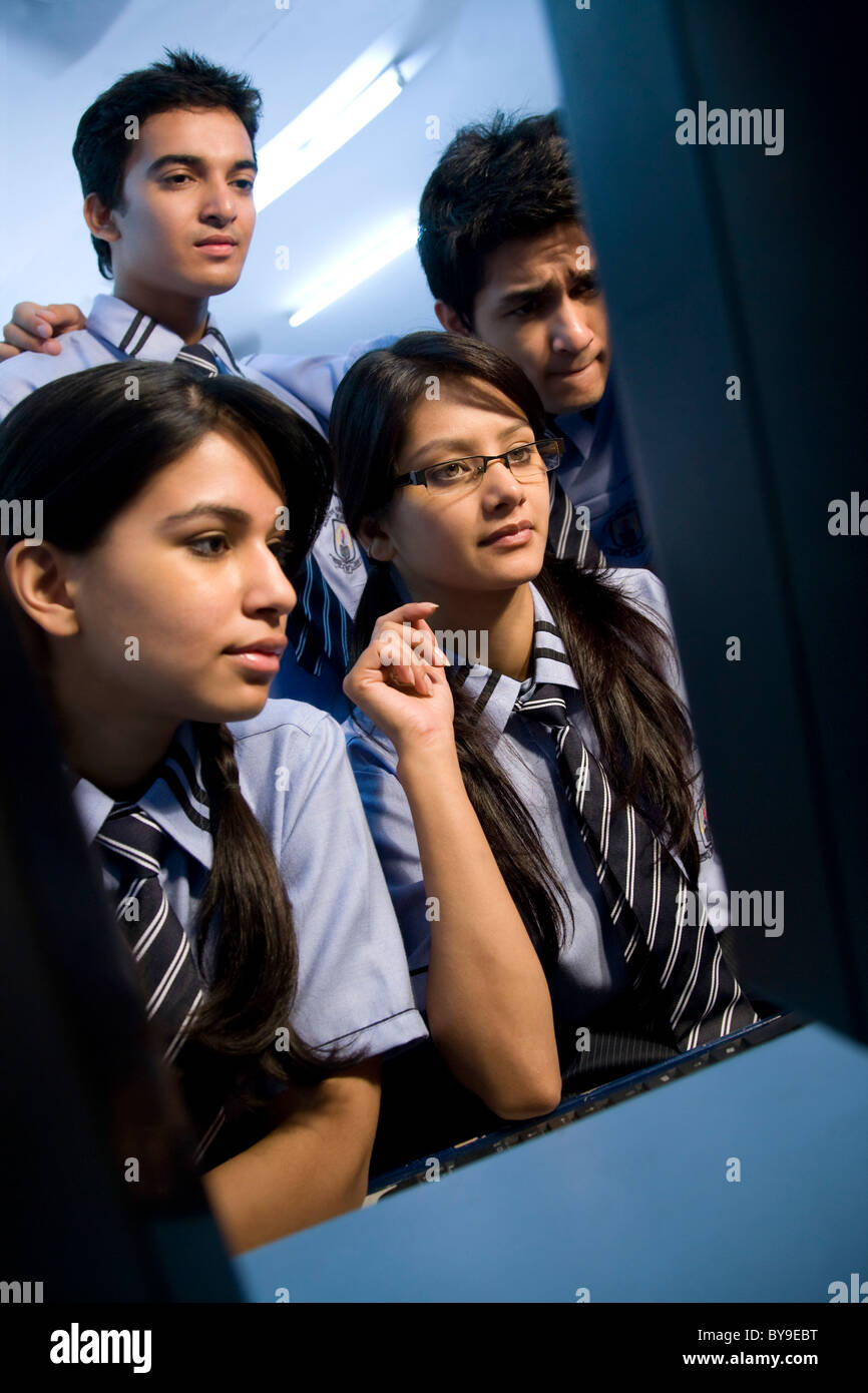 Students looking at a computer screen Stock Photo - Alamy