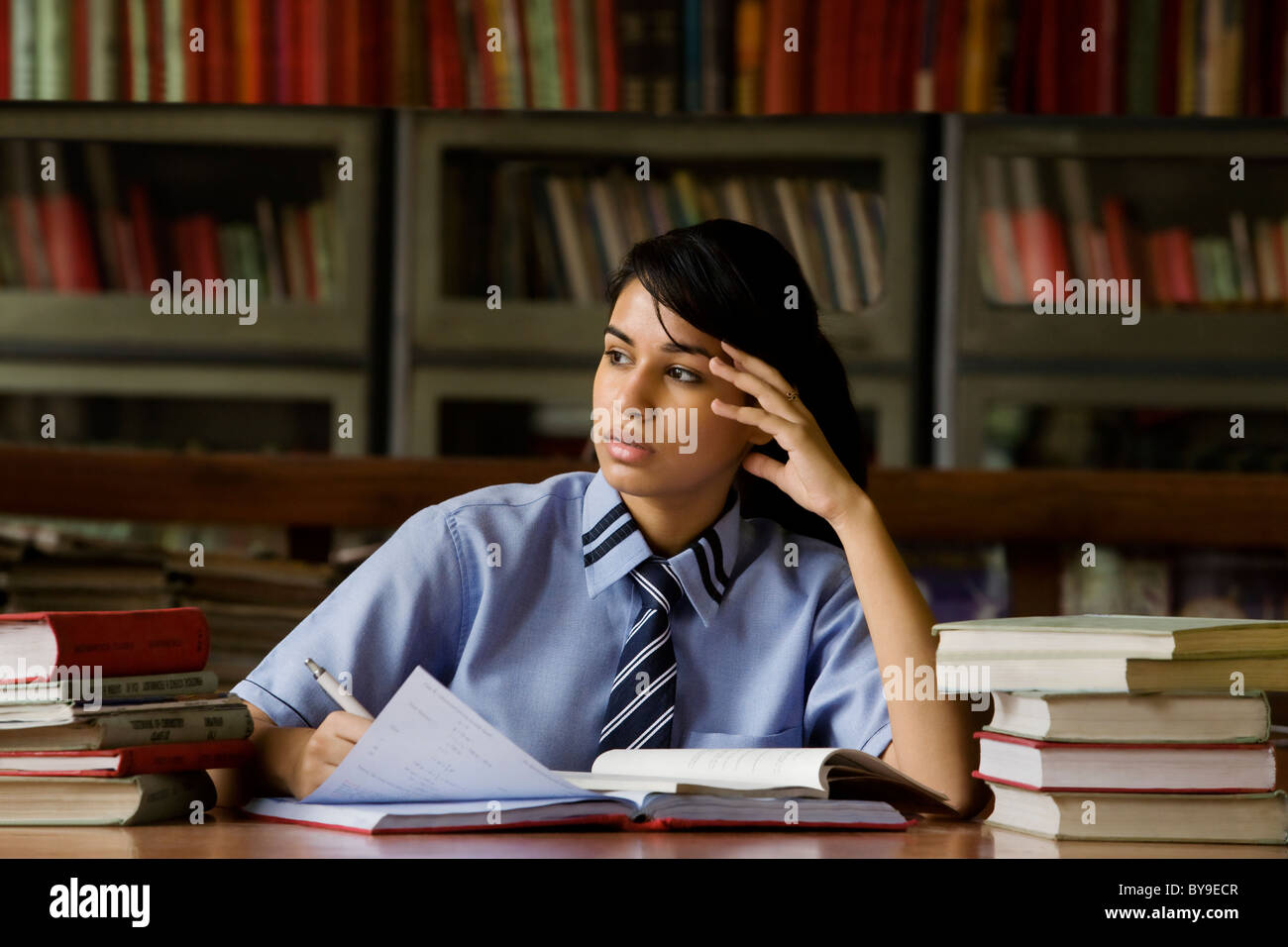 Girl in a school library Stock Photo - Alamy