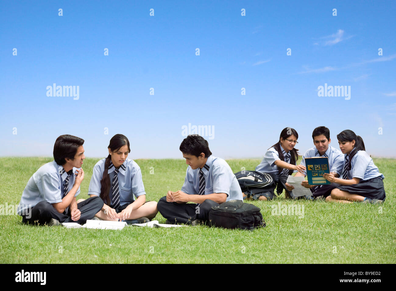 Students sitting in the garden of a school Stock Photo - Alamy