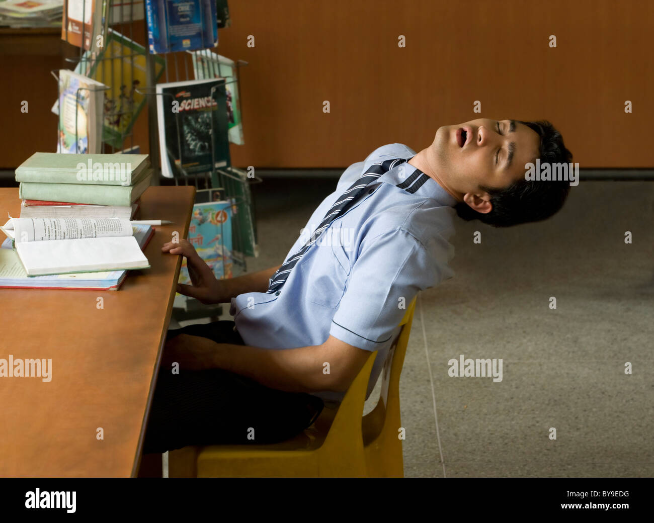 School boy sleeping on chair hi-res stock photography and images - Alamy
