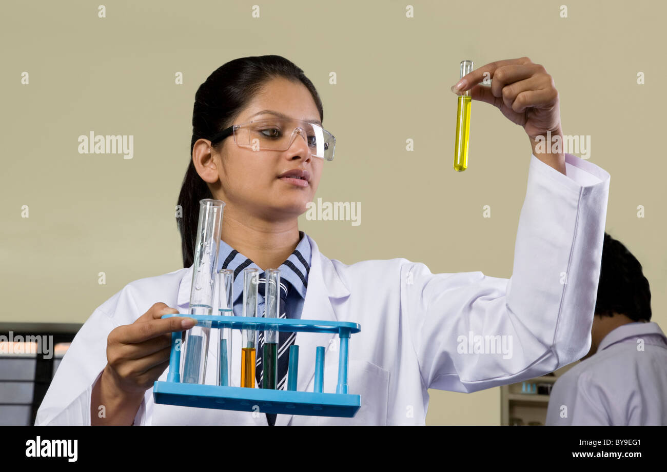 Girl holding a test tube with a chemical Stock Photo - Alamy