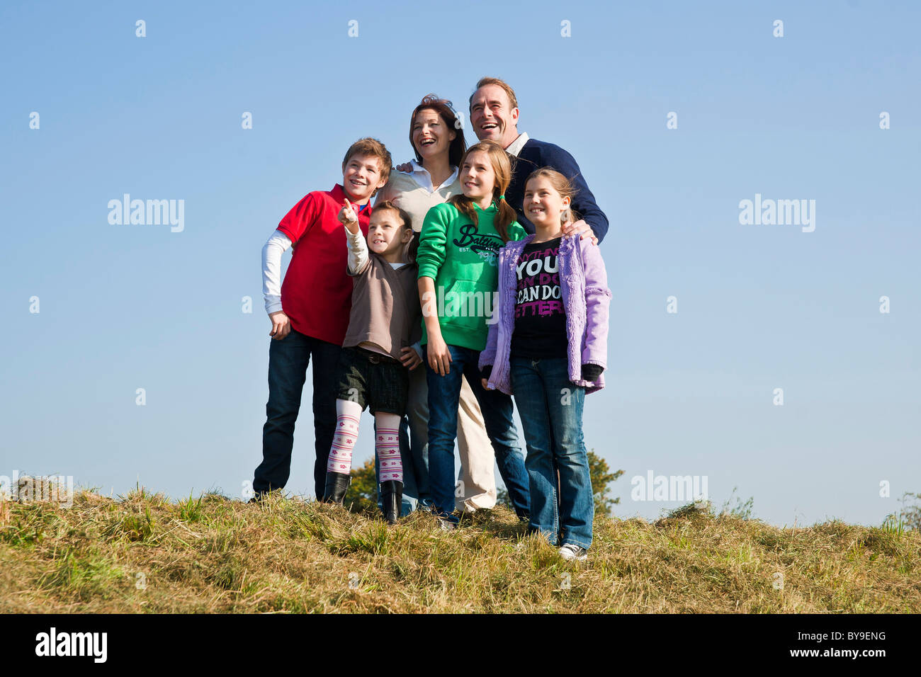 Happy family outdoors Stock Photo - Alamy