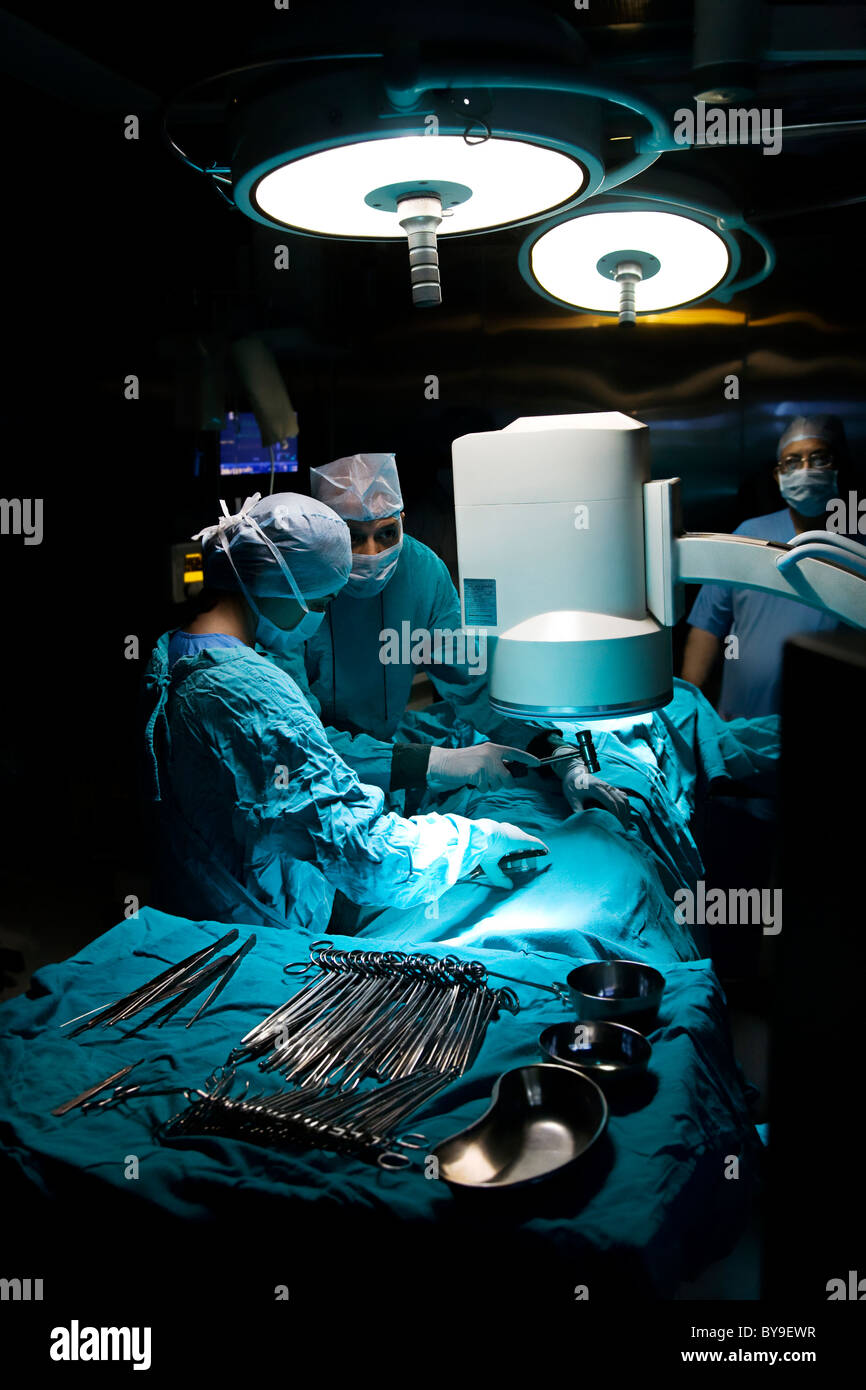 Surgeons performing an operation Stock Photo - Alamy