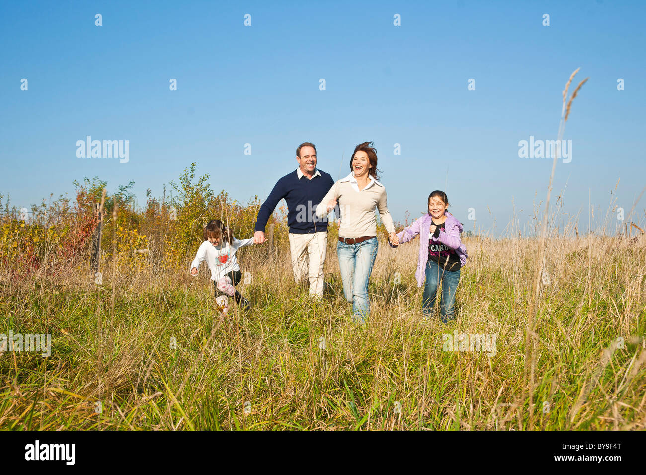 Happy family outdoors Stock Photo - Alamy