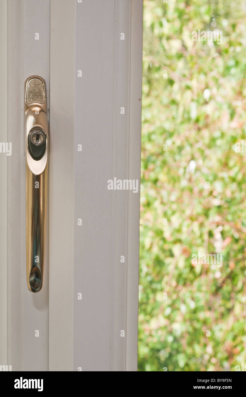 Window handle on uPVC window Stock Photo - Alamy