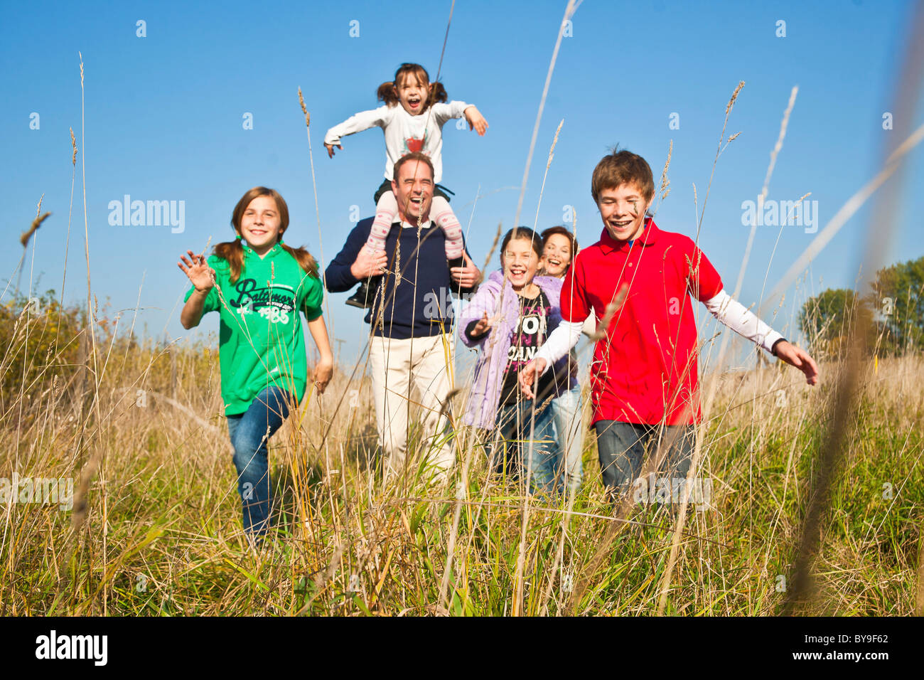 Happy family outdoors Stock Photo - Alamy
