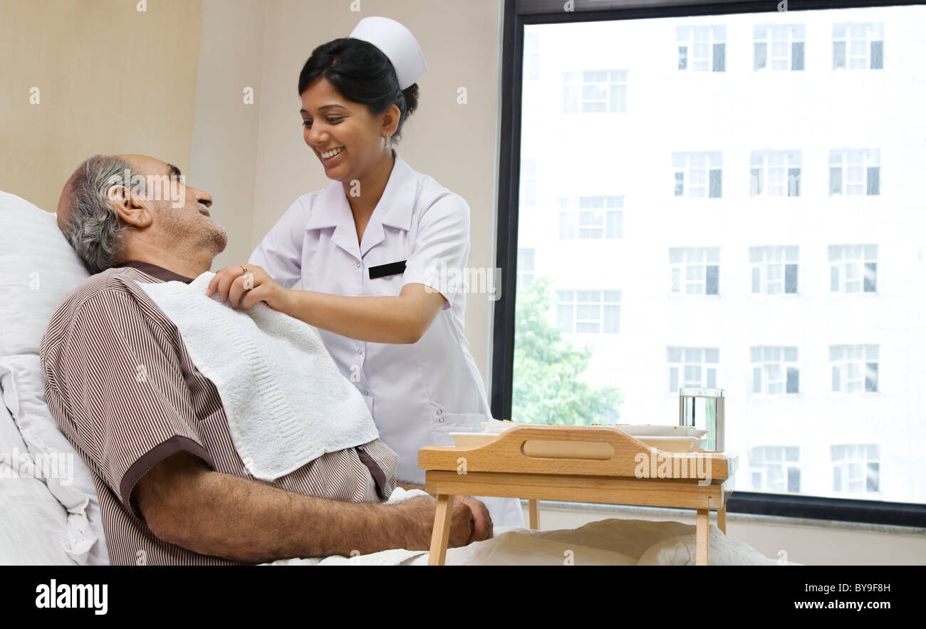 Indian nurse helping patient hi-res stock photography and images - Alamy