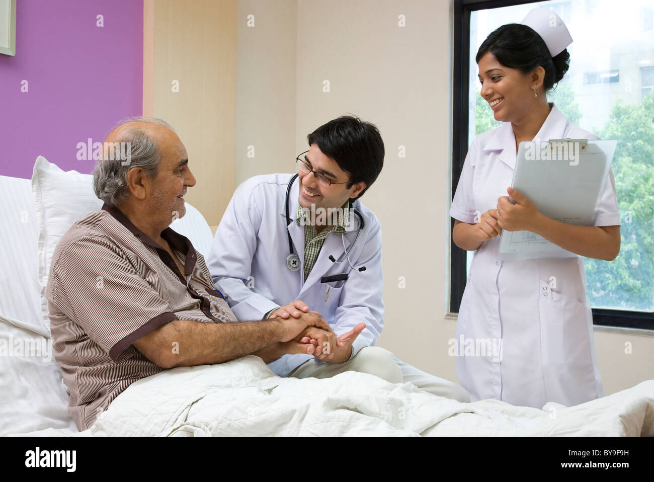 Doctor talking to his patient Stock Photo - Alamy