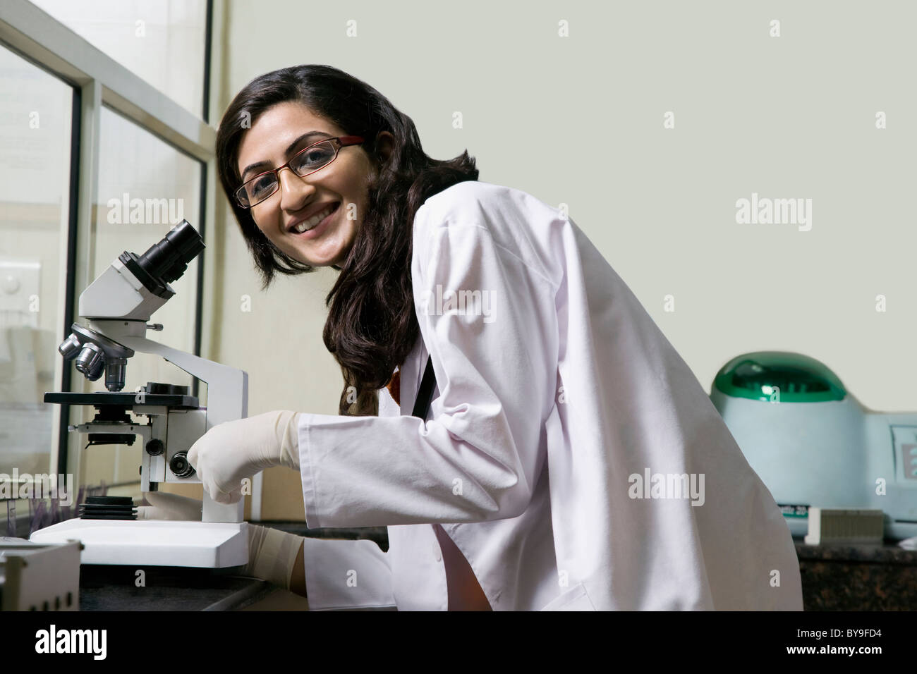 Doctor with a microscope Stock Photo - Alamy