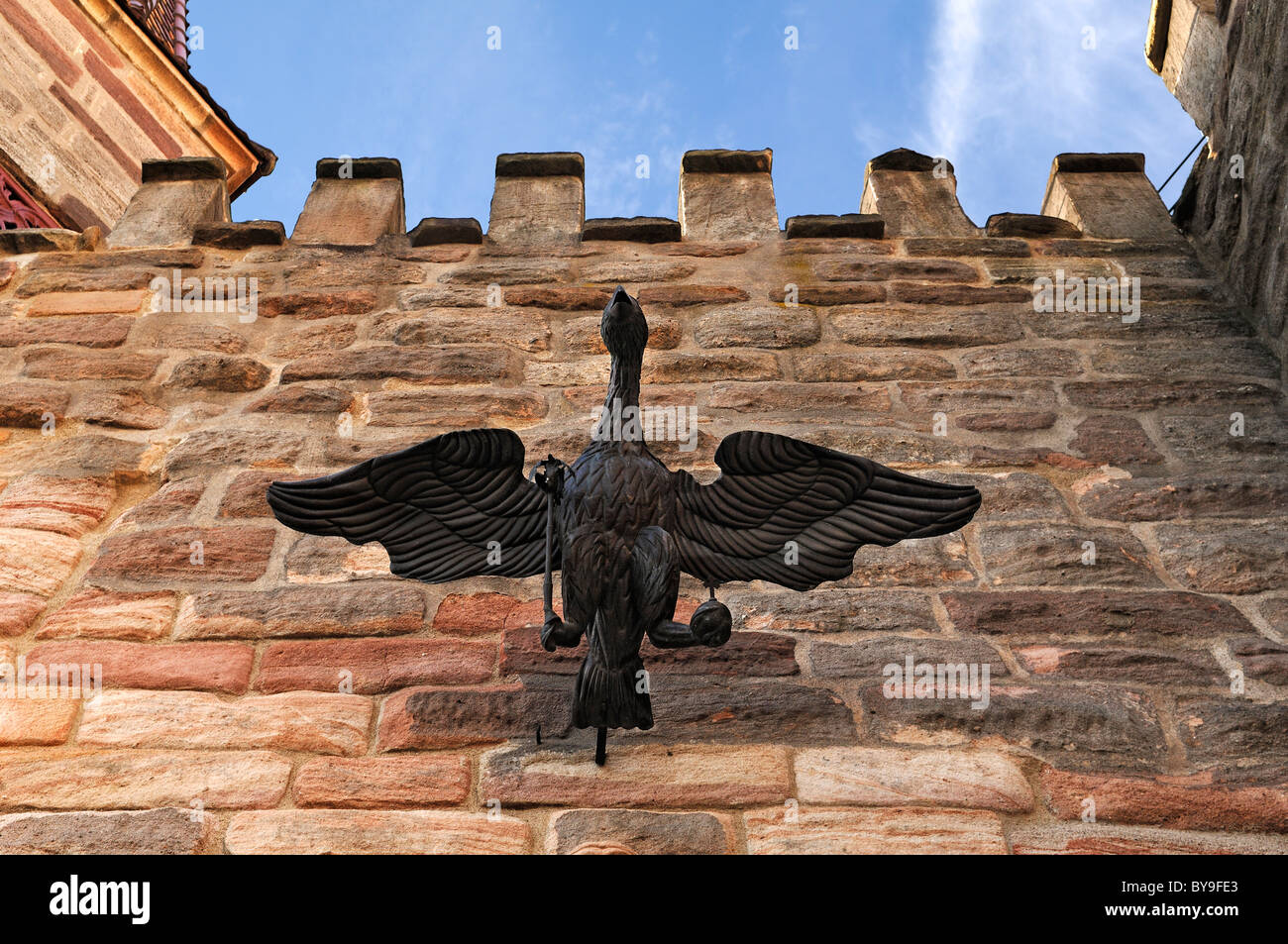 Eagle figure with sceptre and orb above the entrance gate of Abenberg ...