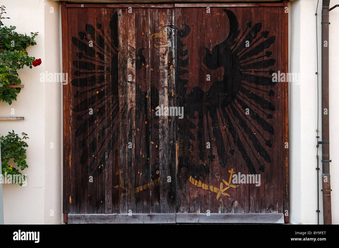 Imperial eagle painted on a wooden gate, Abenberg Castle, Abenberg ...