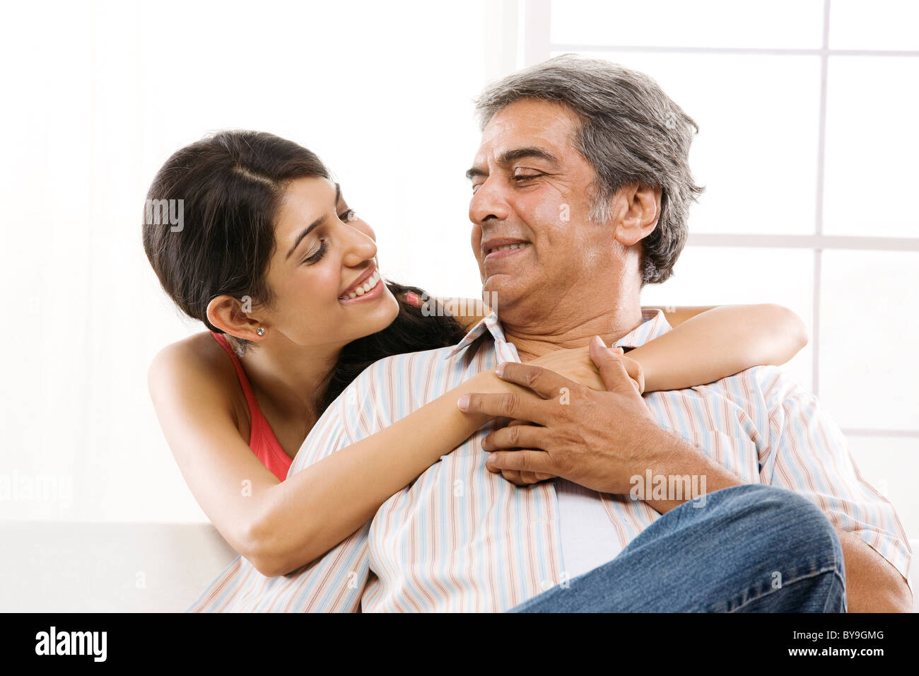 Woman arms around neck man hi-res stock photography and images - Alamy