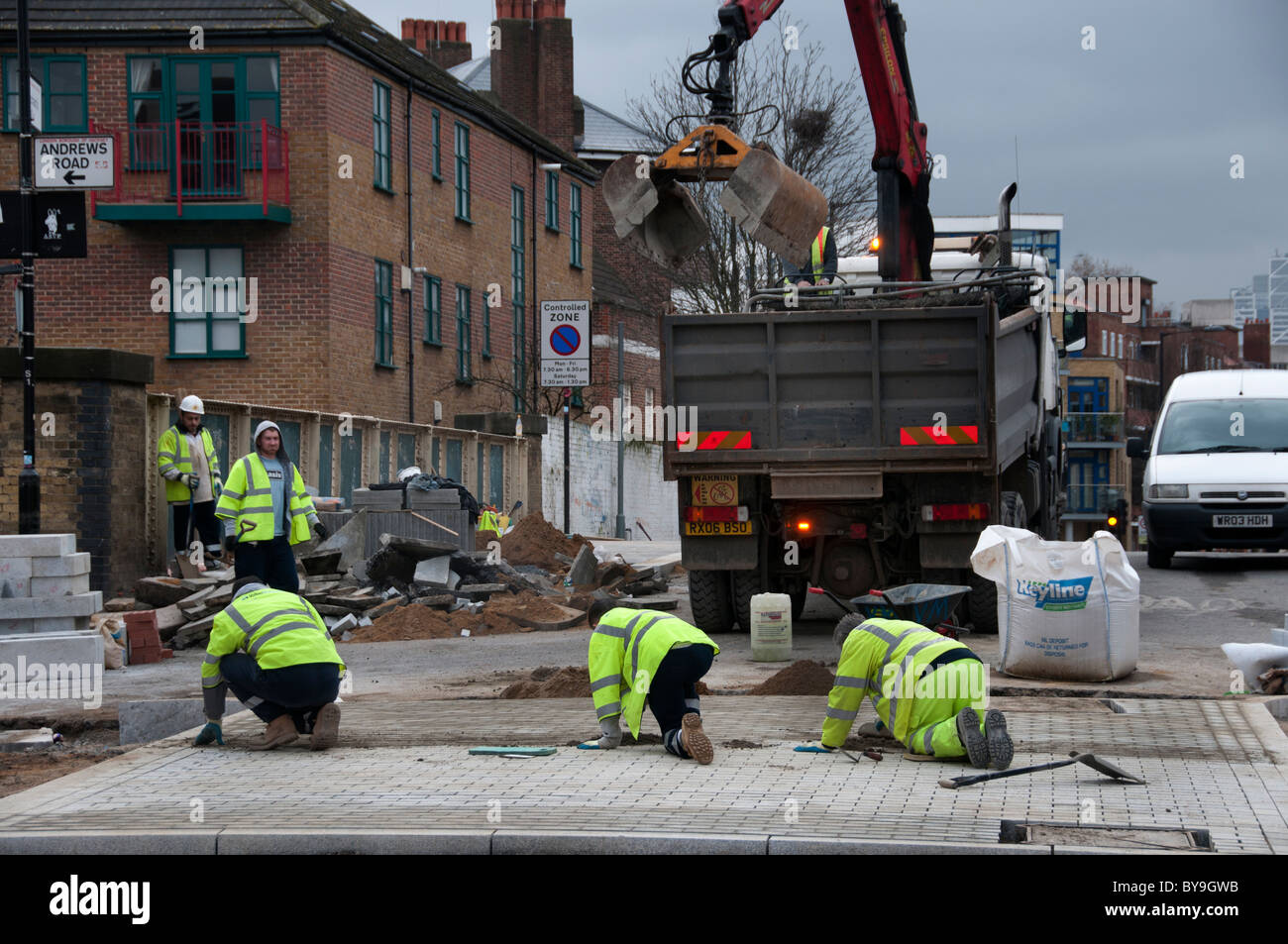 Workers building a new road with stones hi-res stock photography and ...