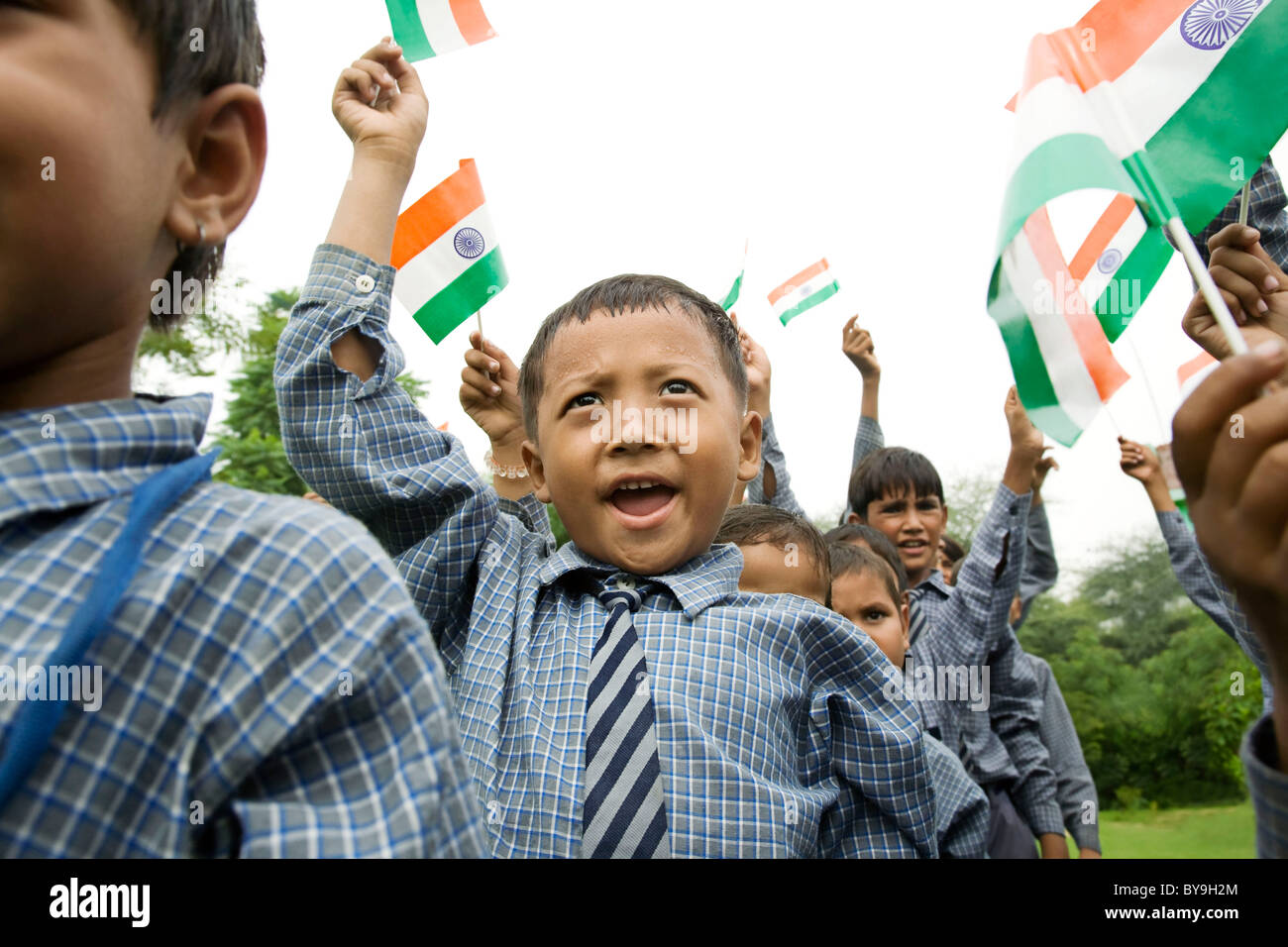School boys holding the Indian flag Stock Photo - Alamy