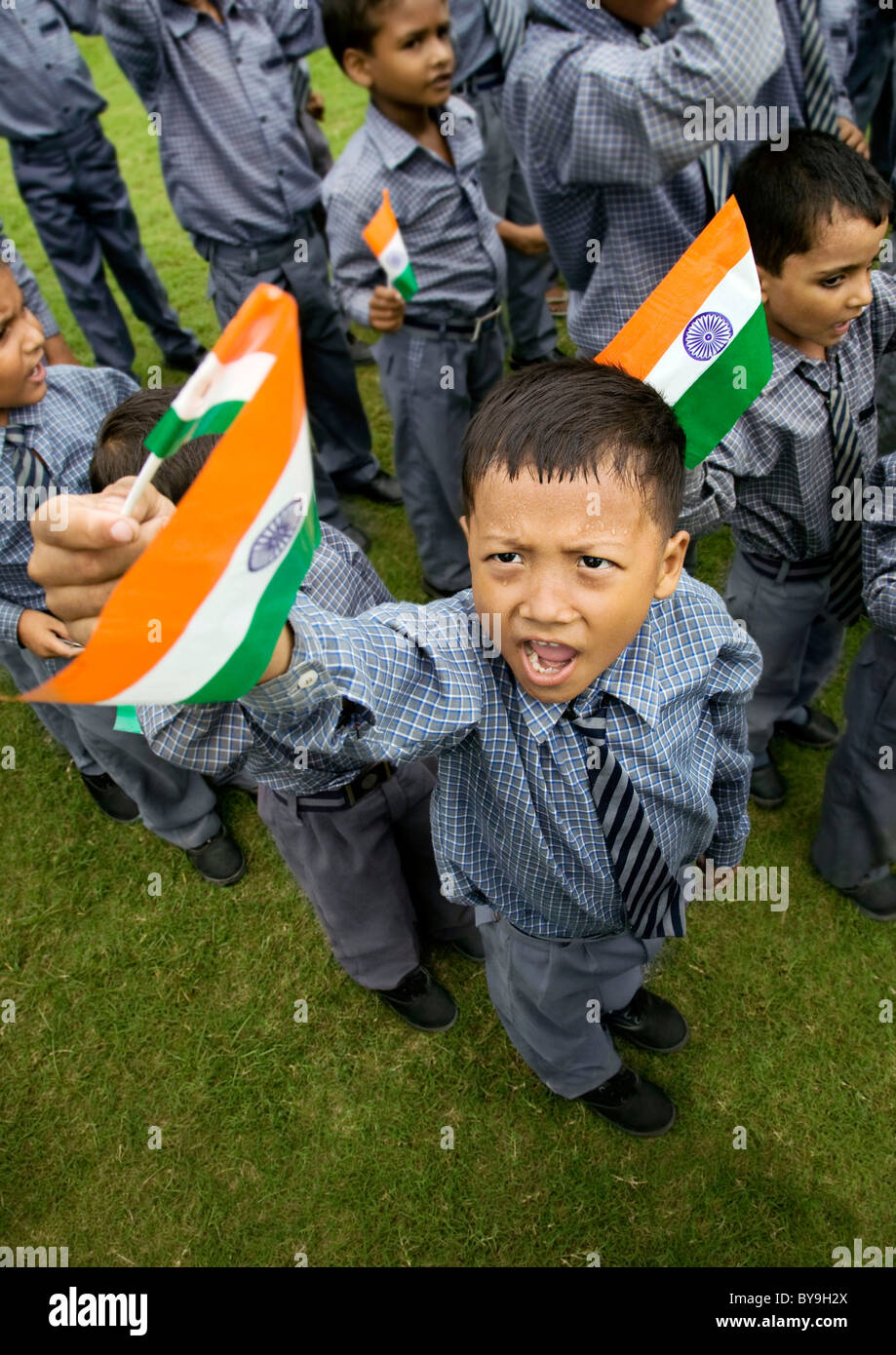 School boys holding the Indian flag Stock Photo - Alamy