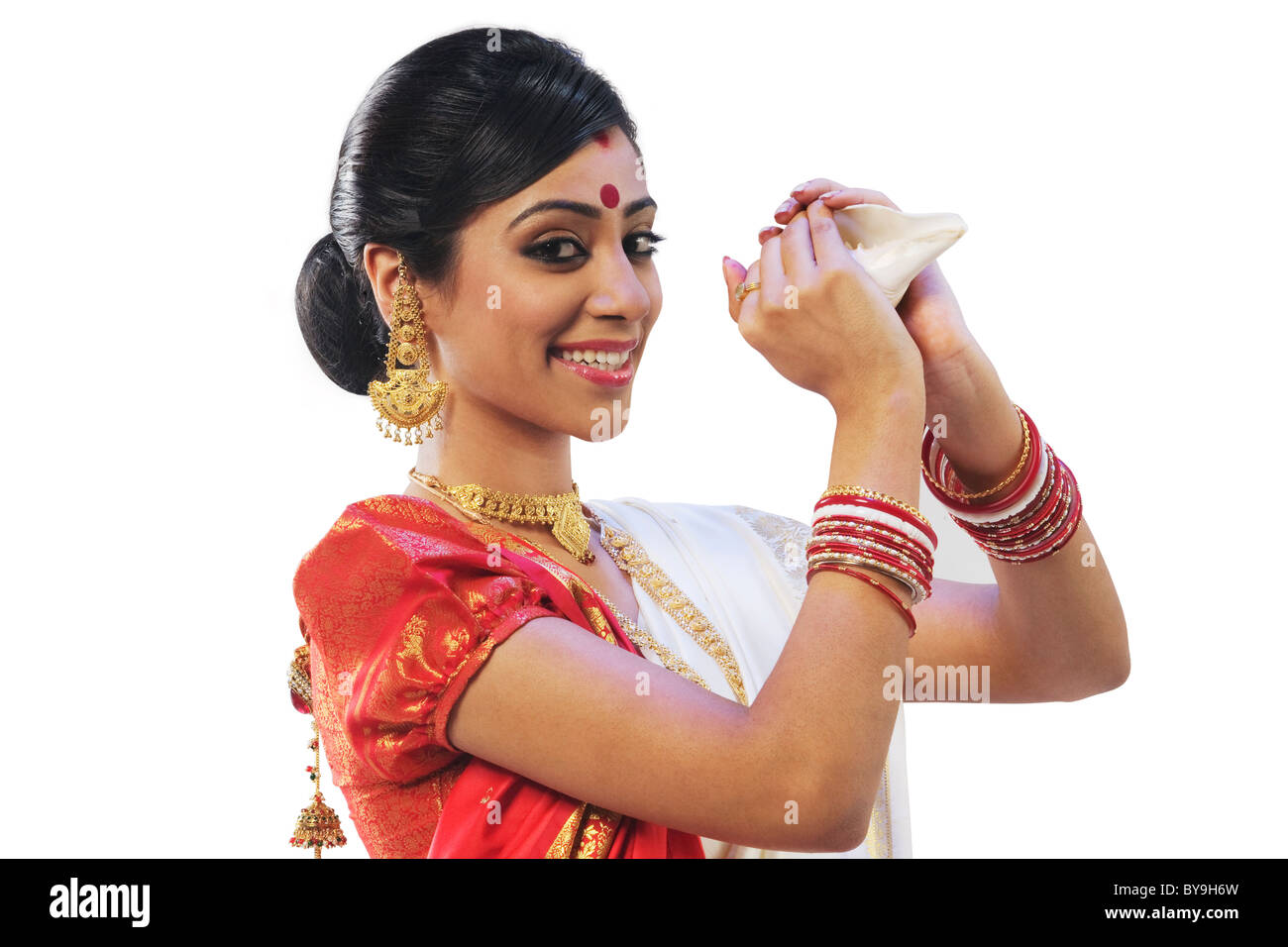 Bengali woman holding on a conch shell hi-res stock photography and ...
