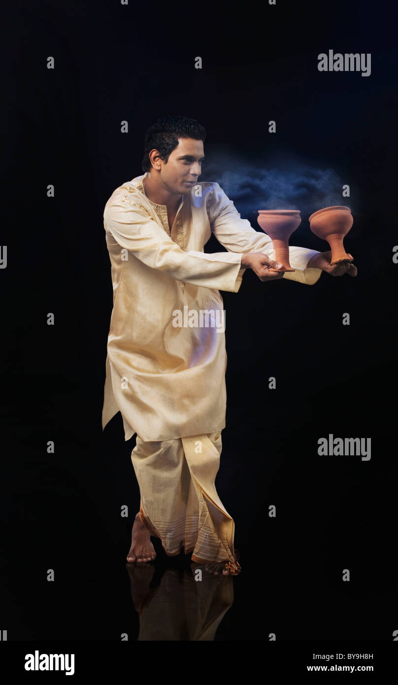 Bengali man doing a Dhunuchi dance Stock Photo - Alamy